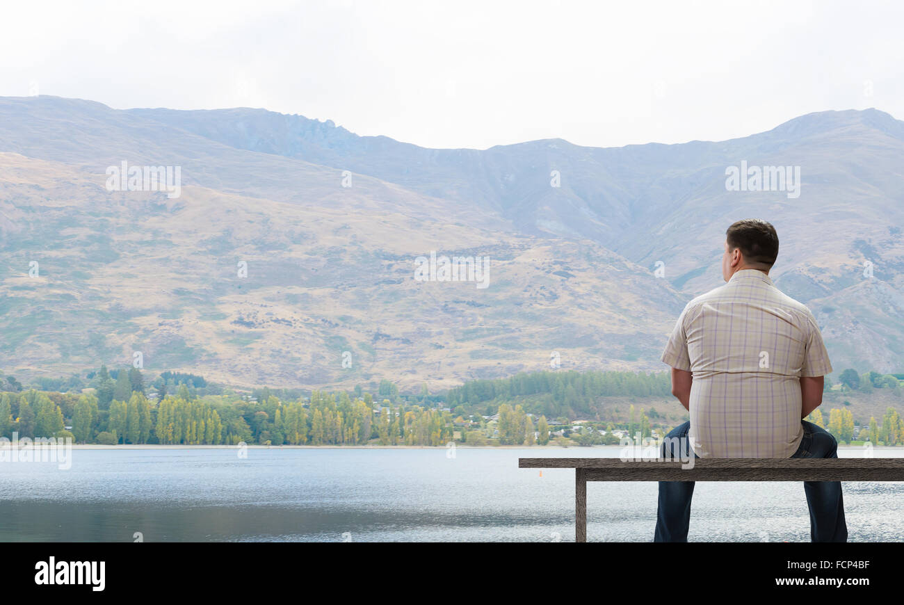 Fat man sitting on bench with his back and looking away Stock Photo - Alamy