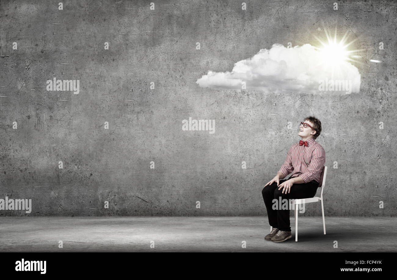 Young funny teenager guy sitting in chair Stock Photo - Alamy