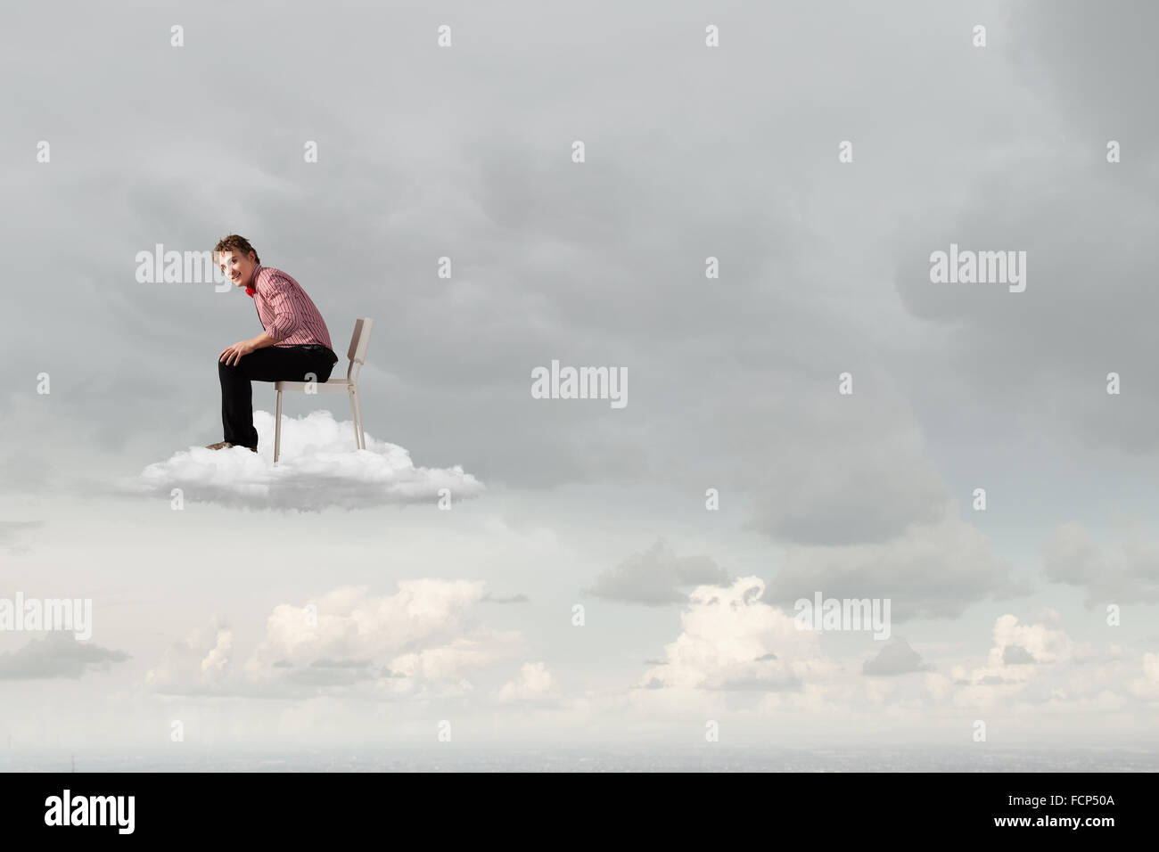 Young funny teenager guy sitting in chair Stock Photo - Alamy