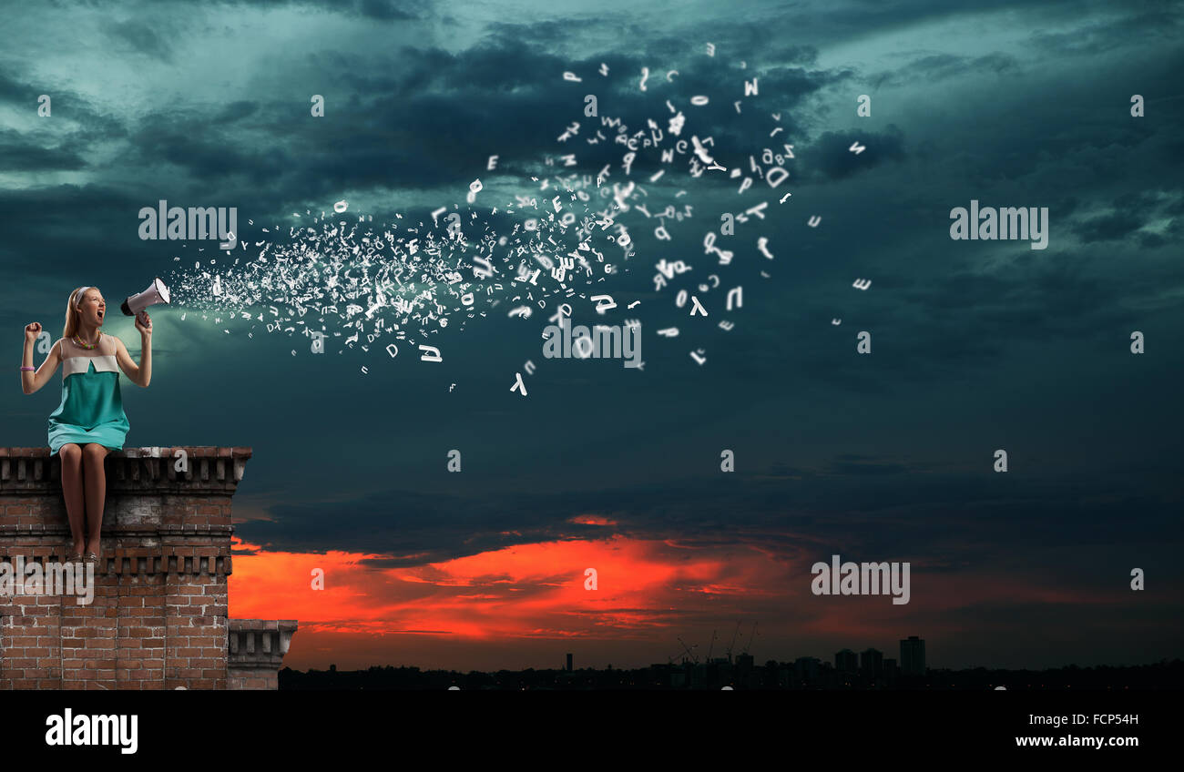 Young woman sitting on roof and screaming in megaphone Stock Photo - Alamy