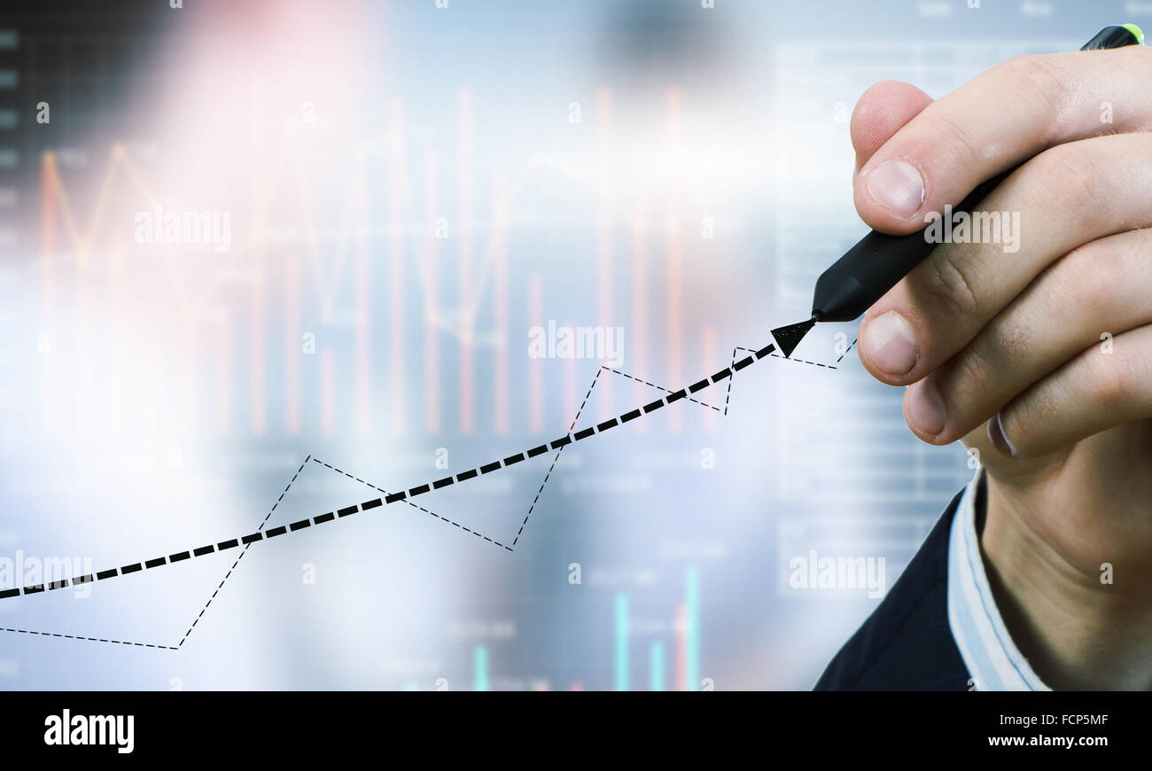 Businessman hand drawing increasing graph on media screen Stock Photo ...