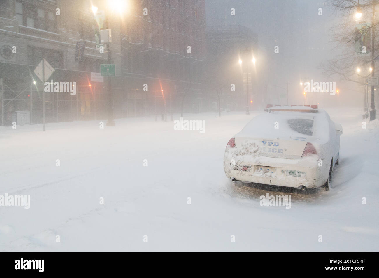 New York, United States. 23rd Jan, 2016. An NYPD car burried in snow ...