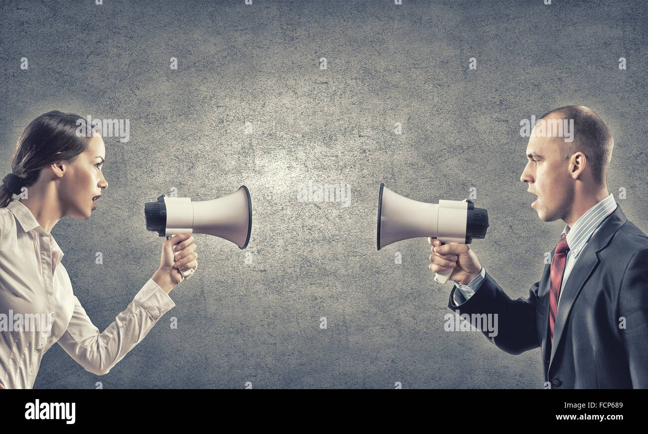 Young furious woman screaming agressively in megaphone Stock Photo - Alamy