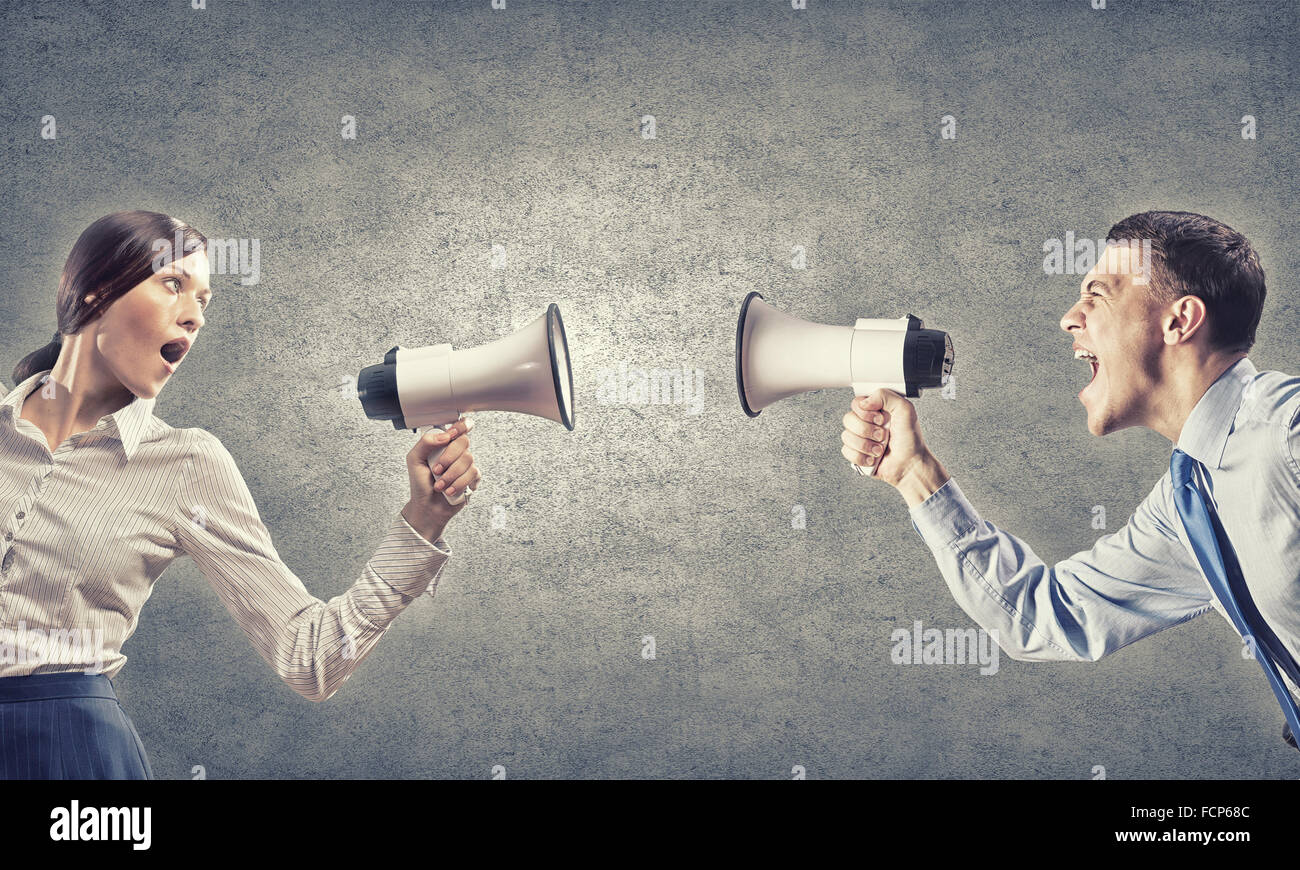 Young furious woman screaming agressively in megaphone Stock Photo - Alamy