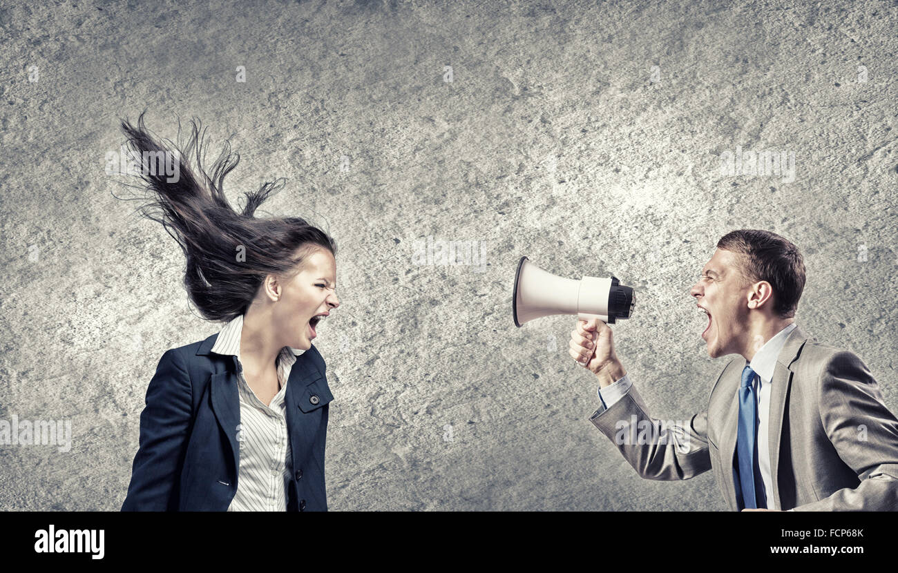 Young furious woman screaming agressively in megaphone Stock Photo - Alamy