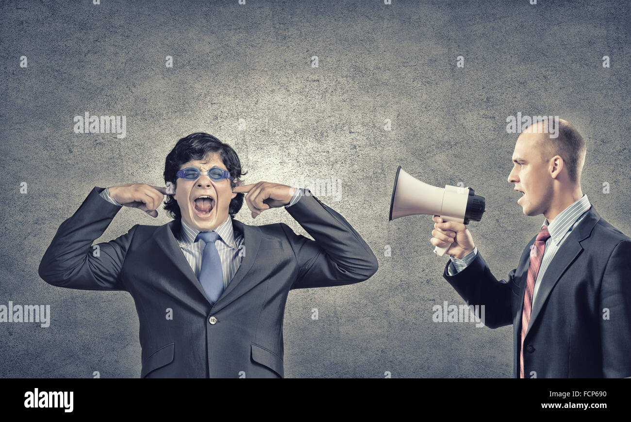 Young furious woman screaming agressively in megaphone Stock Photo - Alamy