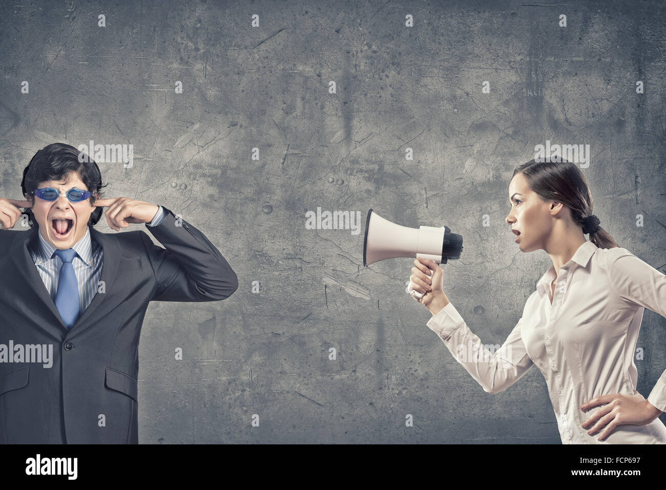 Young furious woman screaming agressively in megaphone Stock Photo - Alamy