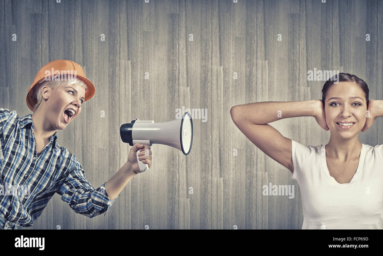 Young furious woman screaming agressively in megaphone Stock Photo - Alamy