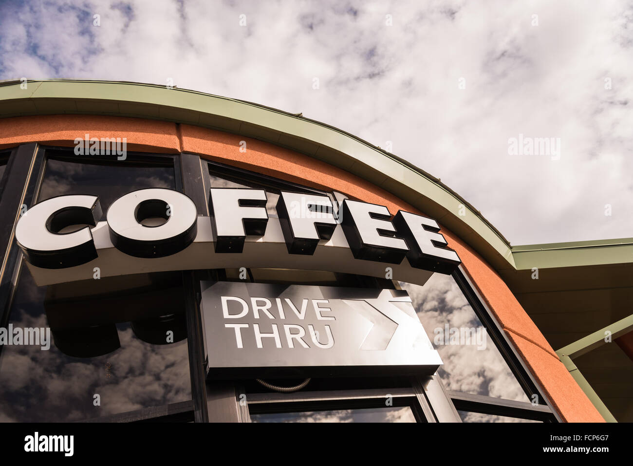 Coffee drive thru sign with cloudy sky 2 Stock Photo - Alamy