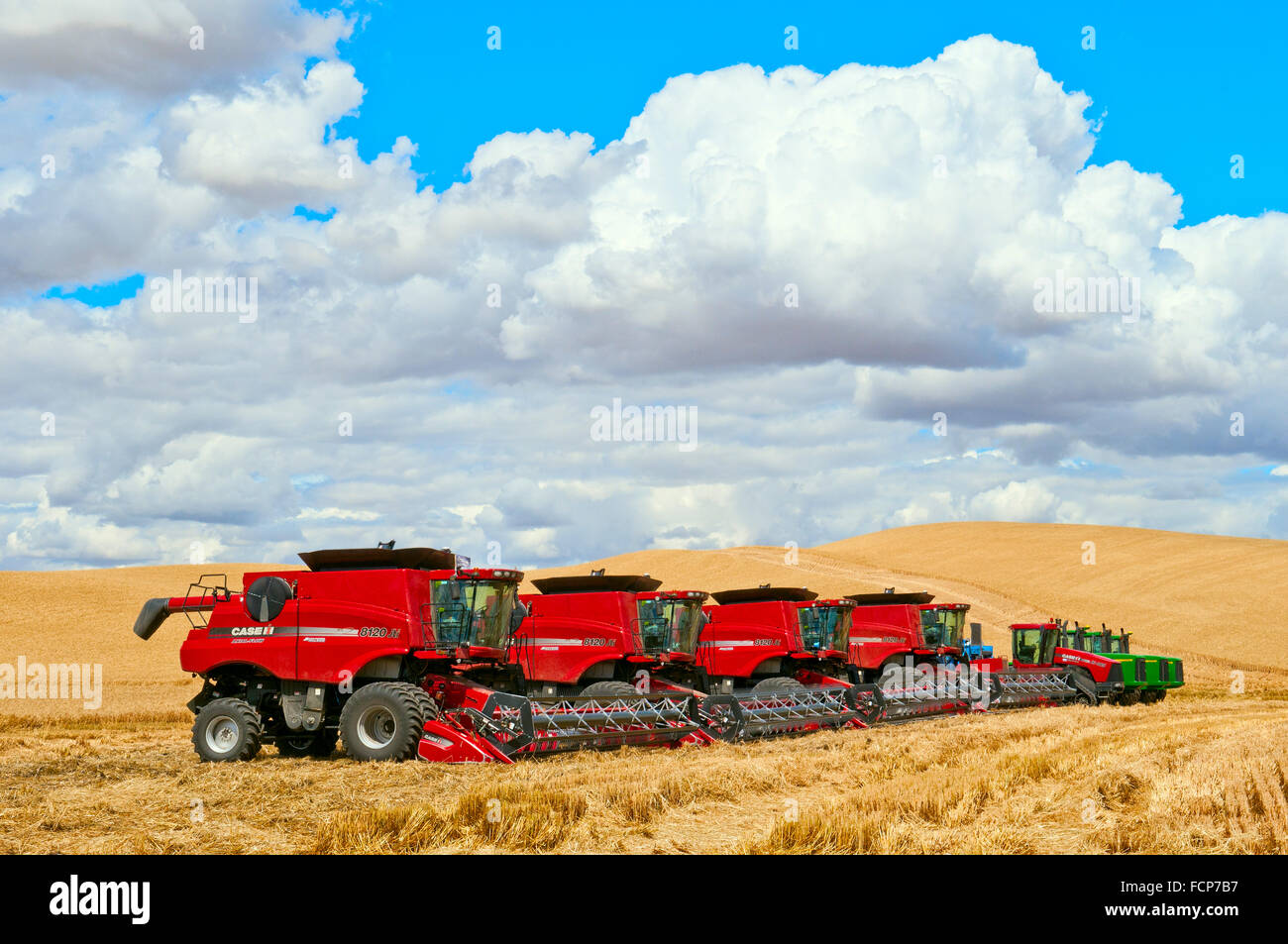 Harvest equipment lined up in a field during a harvest down time Stock ...