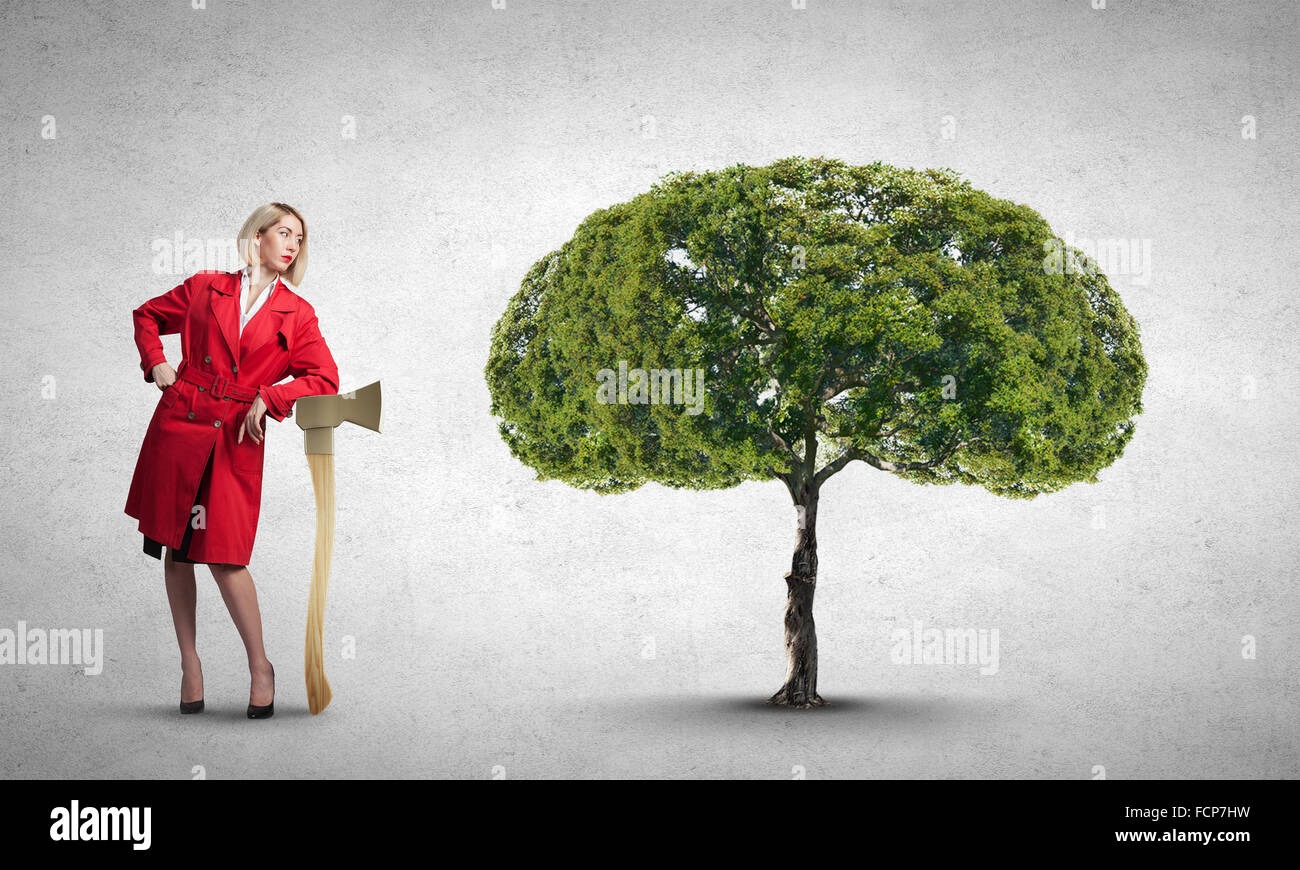 Blond woman in red coat with axe and green tree Stock Photo - Alamy