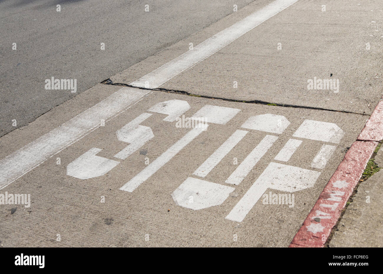 Bus stop sign on the street Stock Photo - Alamy