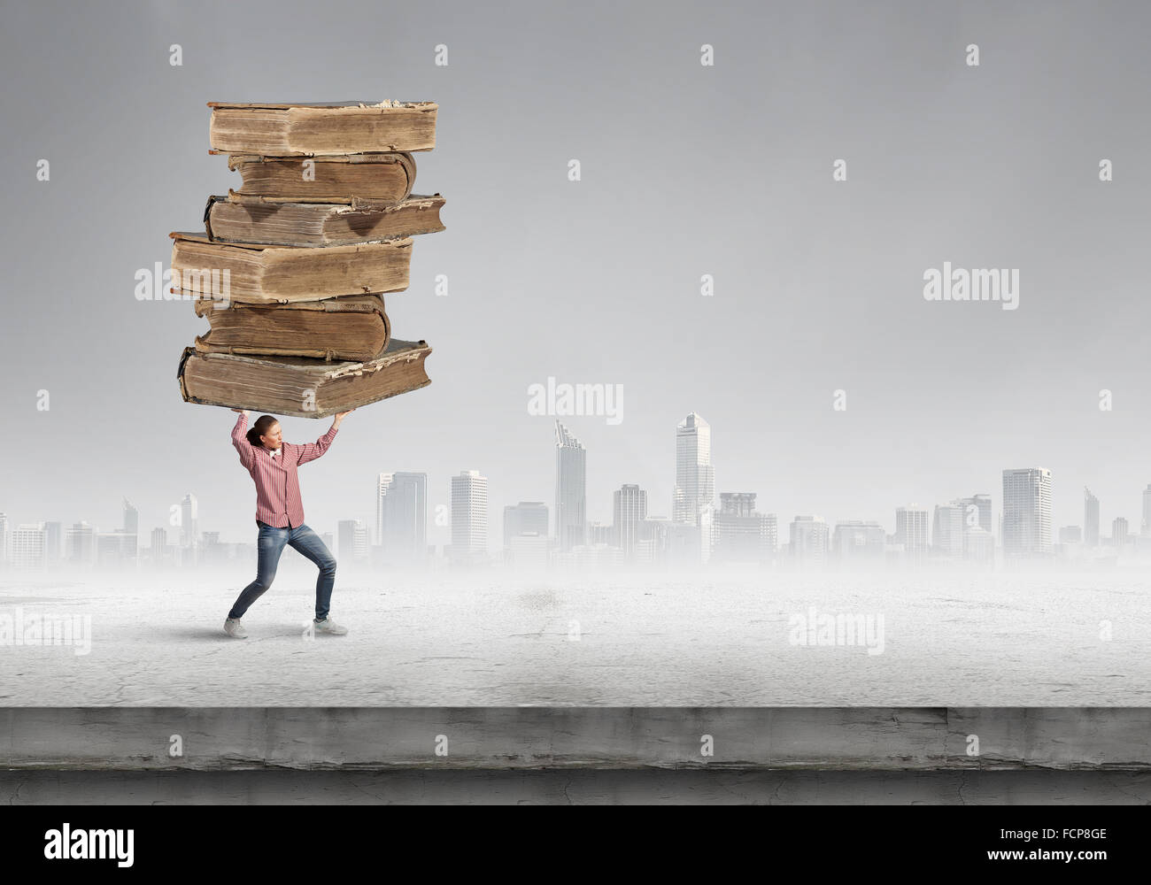Young student girl lifting pile hi-res stock photography and images - Alamy