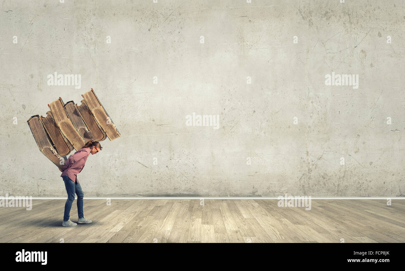 Young student girl lifting pile hi-res stock photography and images - Alamy