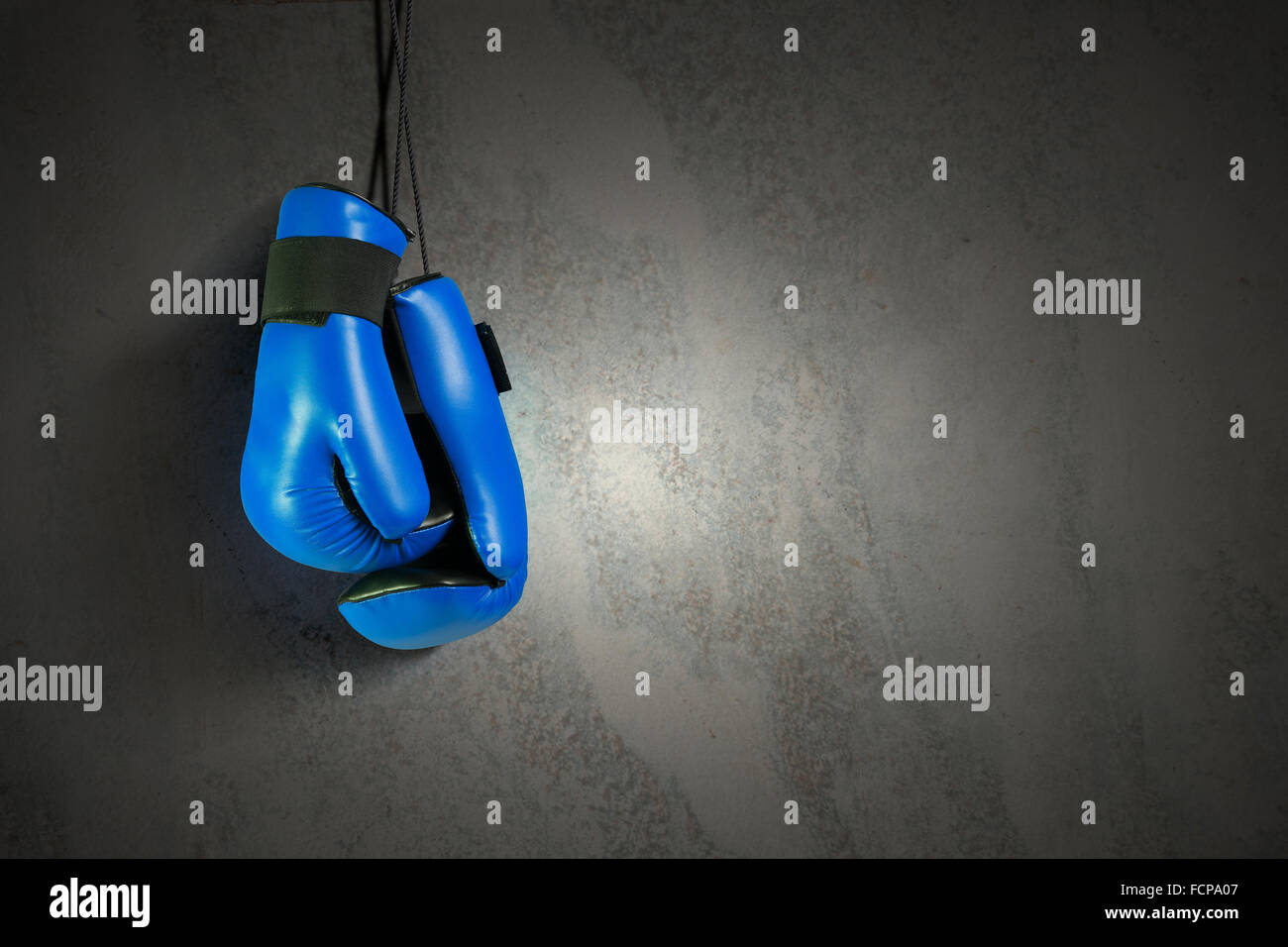 Boxing gloves hanging on nail on wall Stock Photo - Alamy