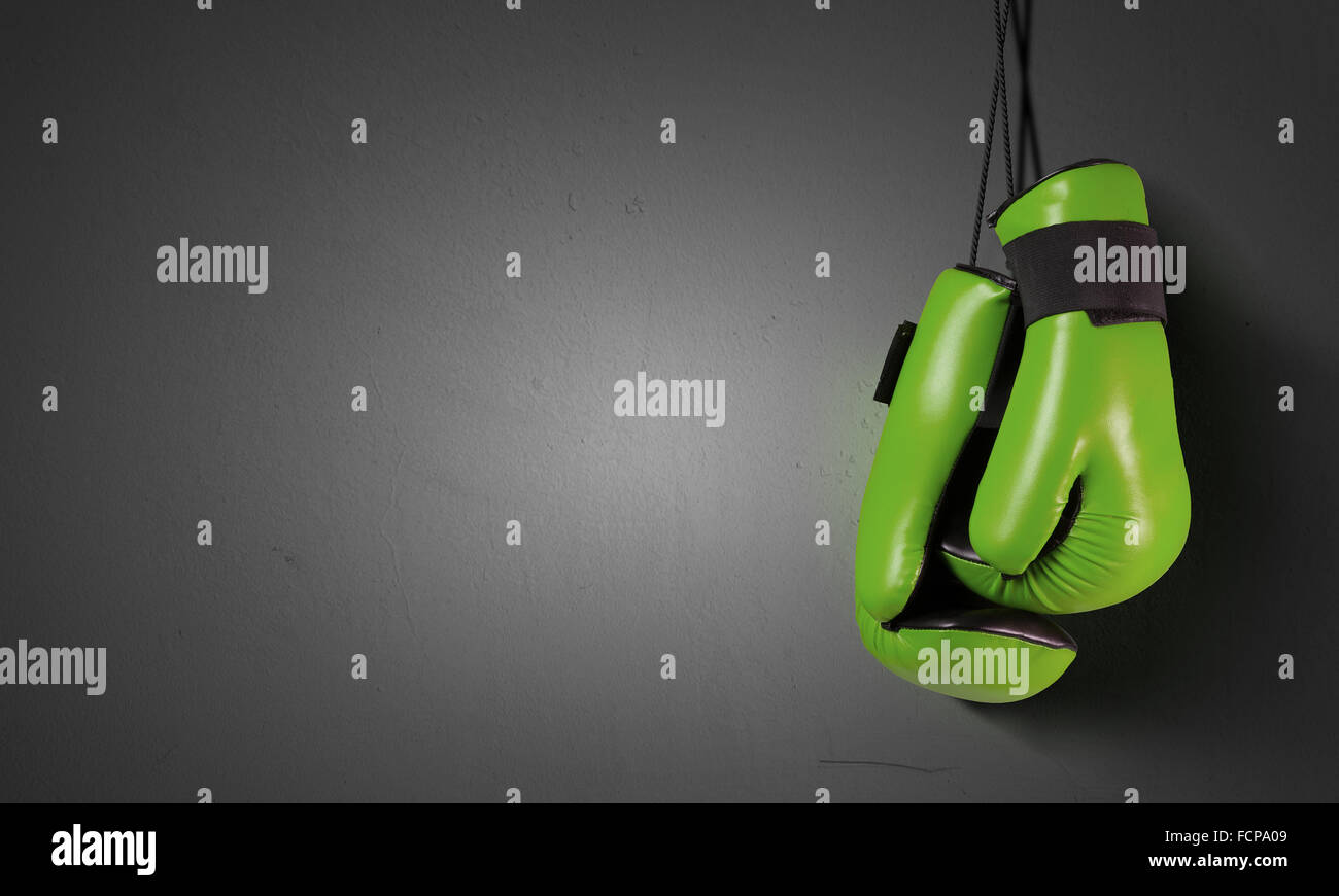Boxing gloves hanging on nail on wall Stock Photo - Alamy