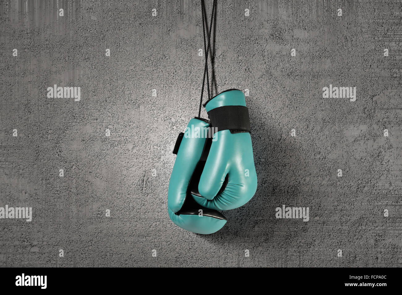 Boxing gloves hanging on nail on wall Stock Photo - Alamy