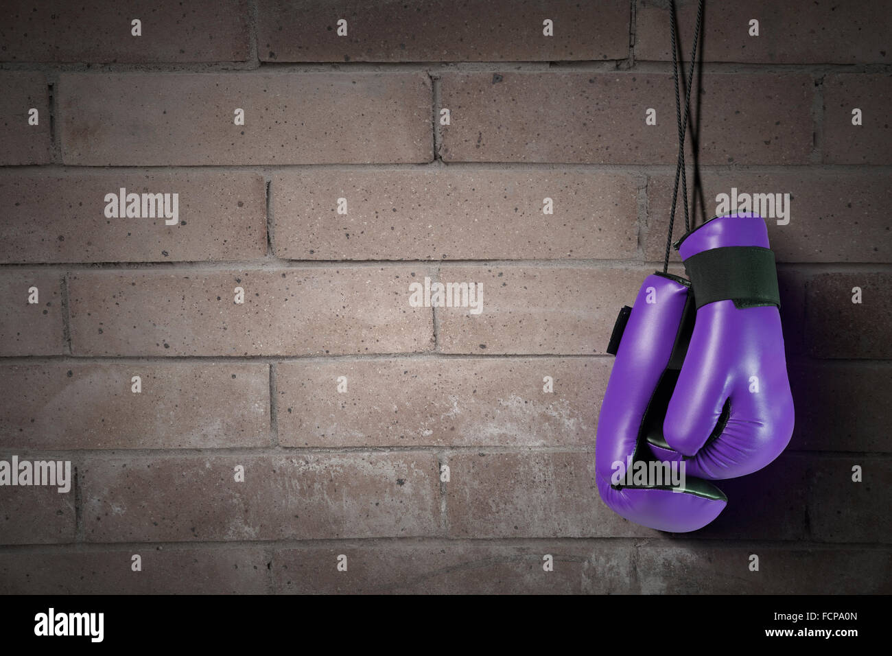 Boxing gloves hanging on nail on wall Stock Photo - Alamy
