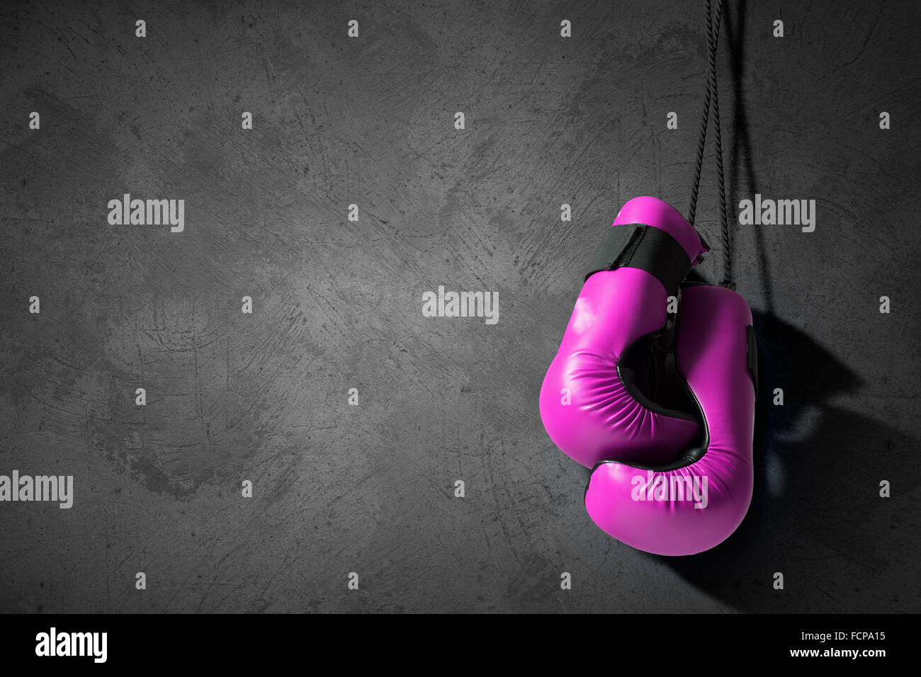 Boxing gloves hanging on nail on wall Stock Photo - Alamy