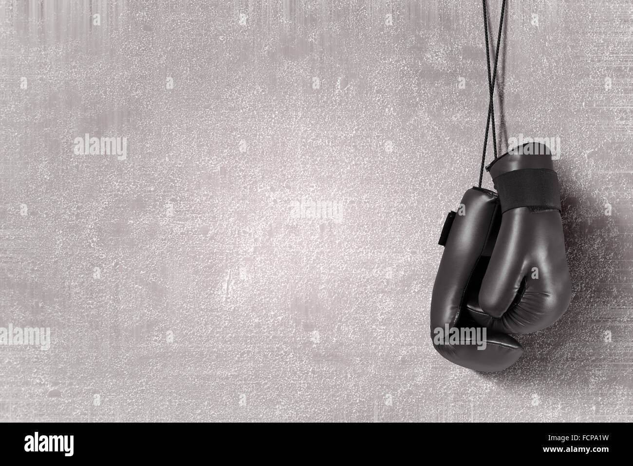 Boxing gloves hanging on nail on wall Stock Photo - Alamy