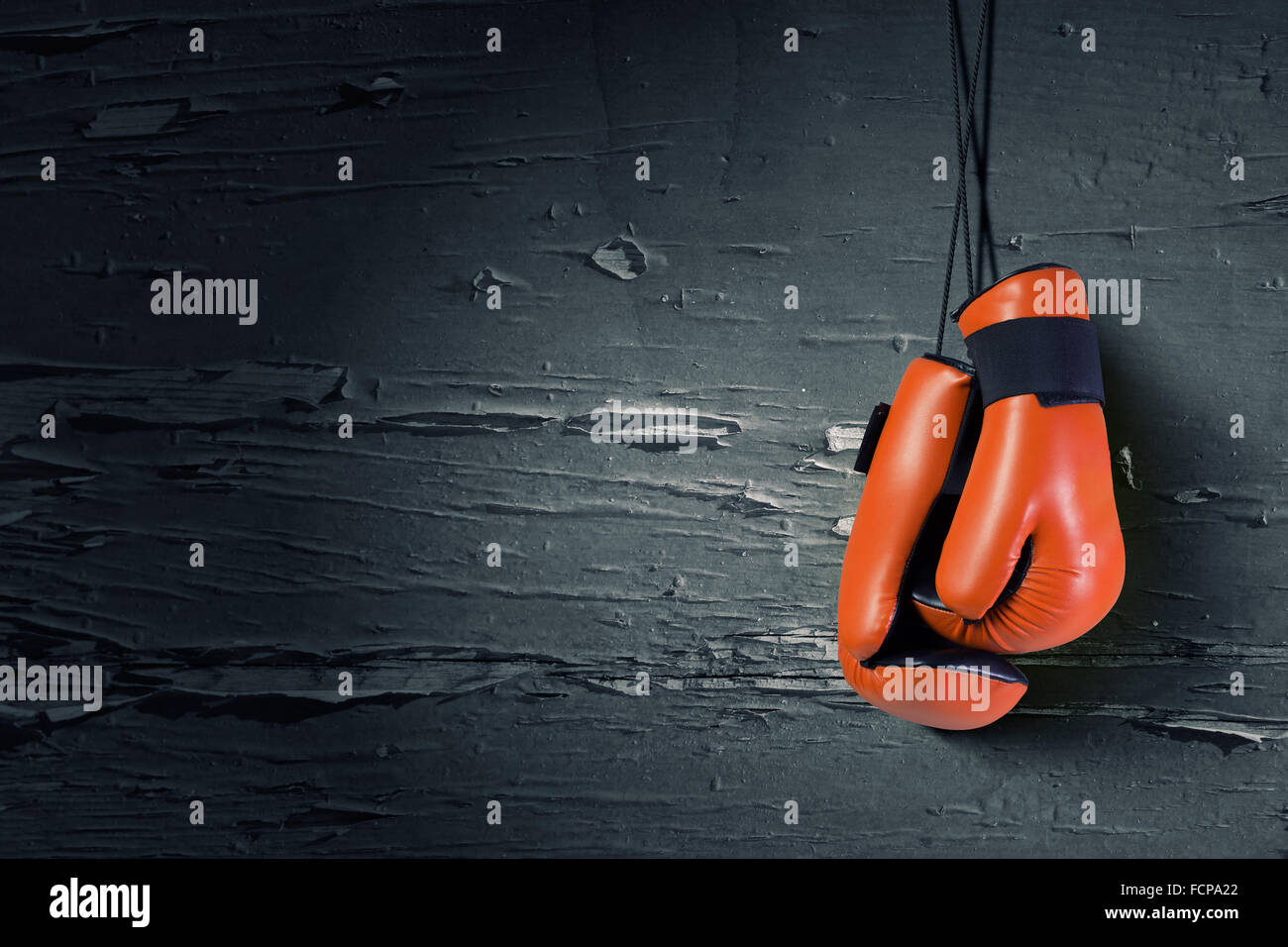 Boxing gloves hanging on nail on wall Stock Photo - Alamy