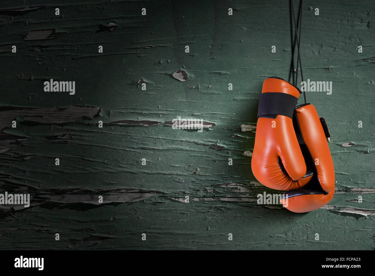 Boxing gloves hanging on nail on wall Stock Photo - Alamy