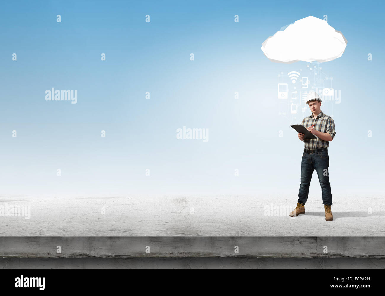 Young man builder looking thoughtfully at construction project. concept ...