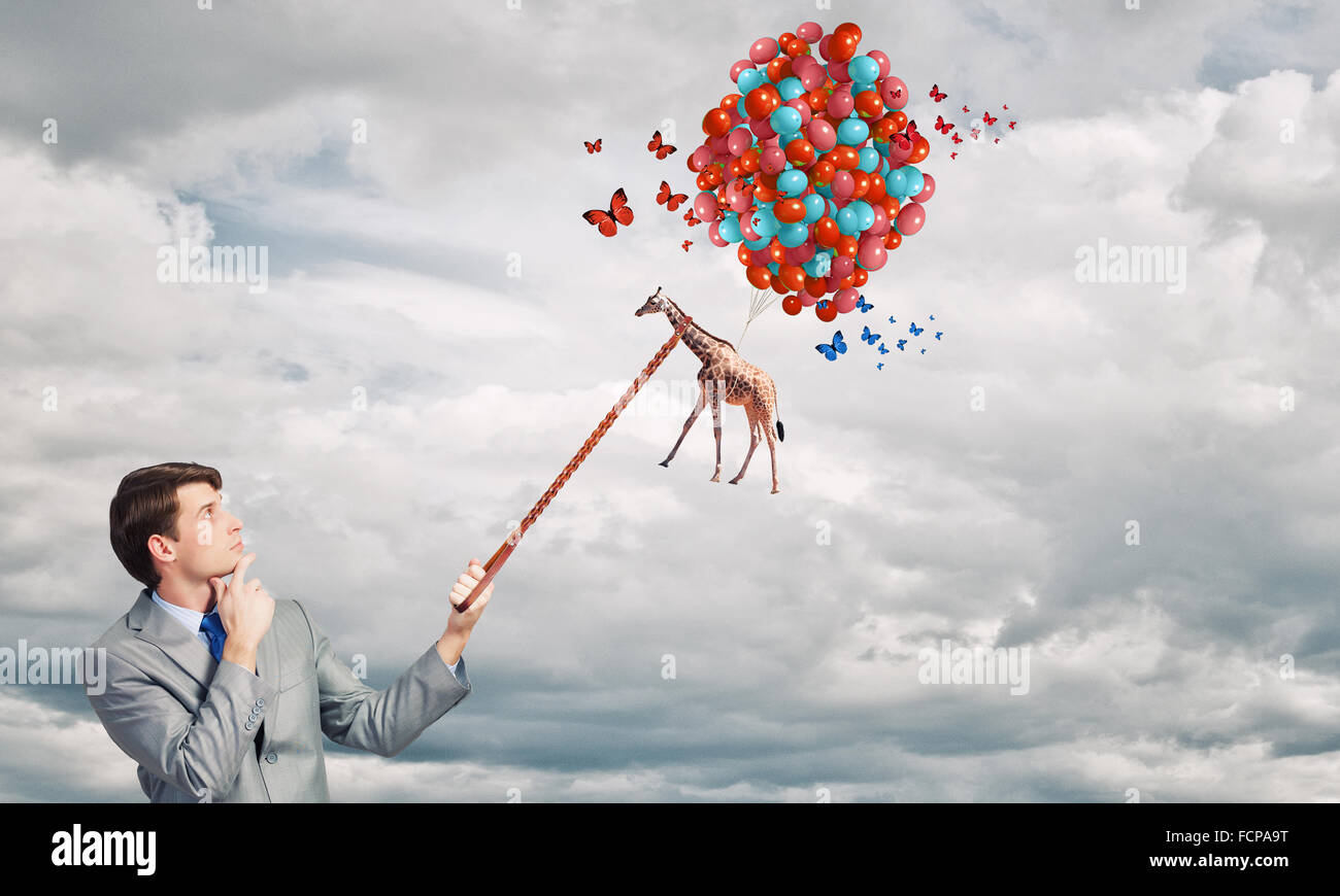 Young businessman caught new idea on lead Stock Photo - Alamy