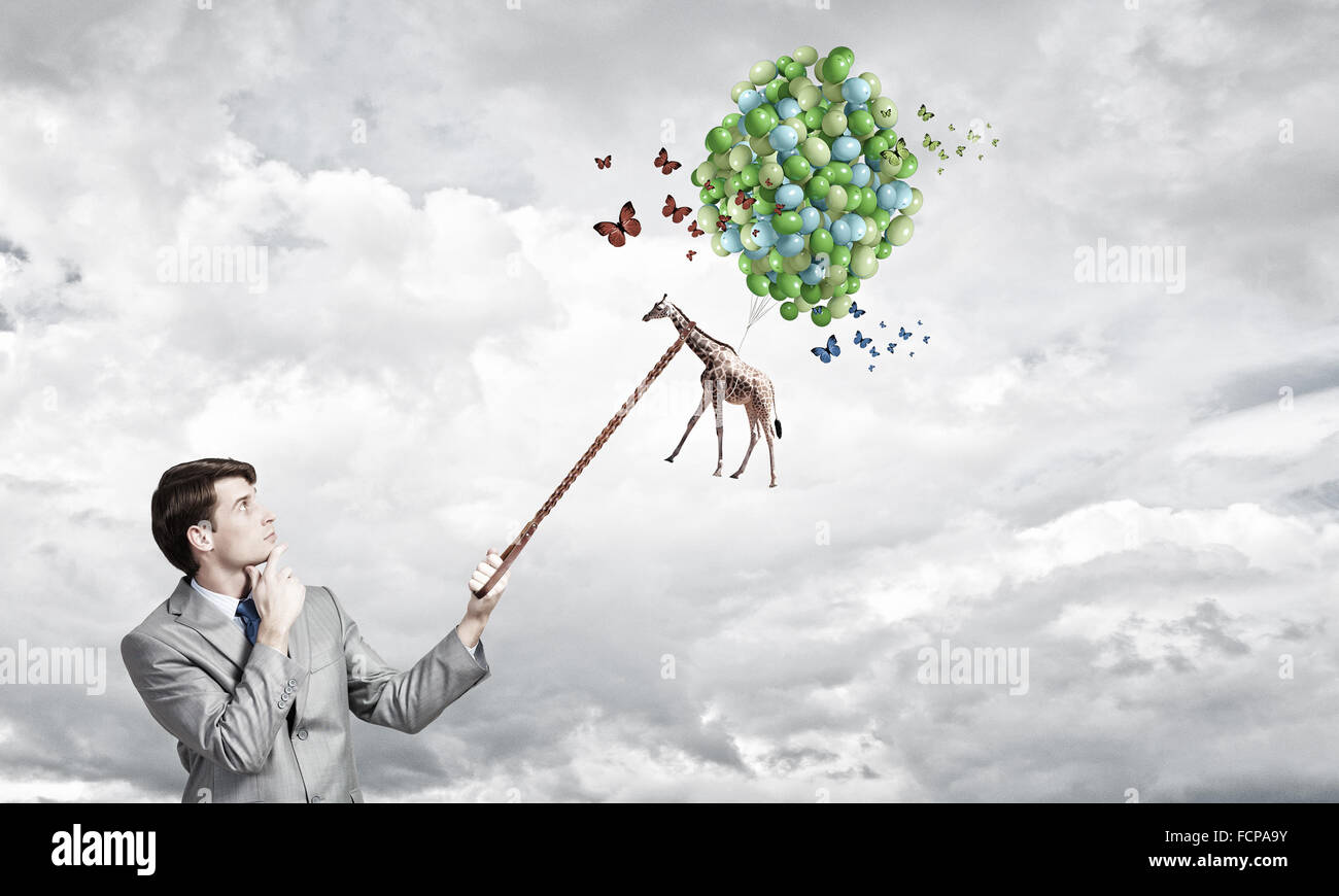 Young businessman caught new idea on lead Stock Photo - Alamy