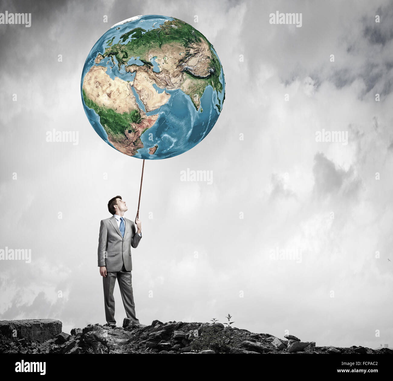 Businessman controlling Earth planet with lead. Elements of this image ...