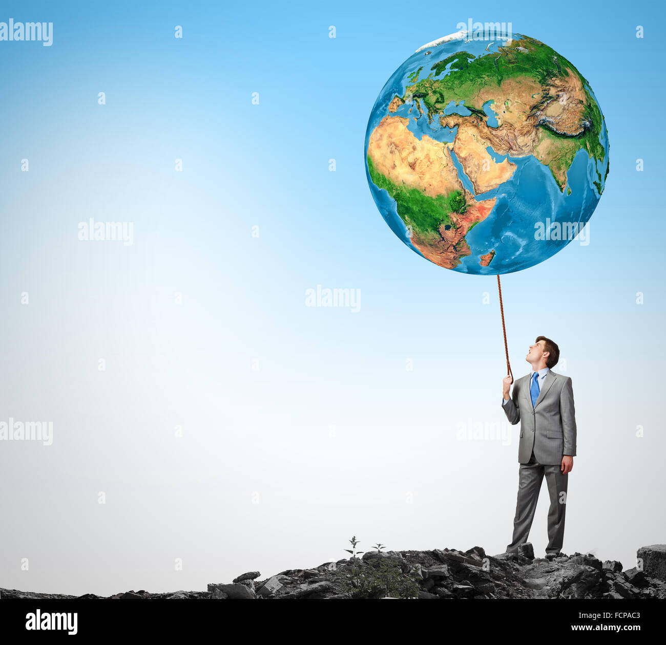 Businessman controlling Earth planet with lead. Elements of this image ...