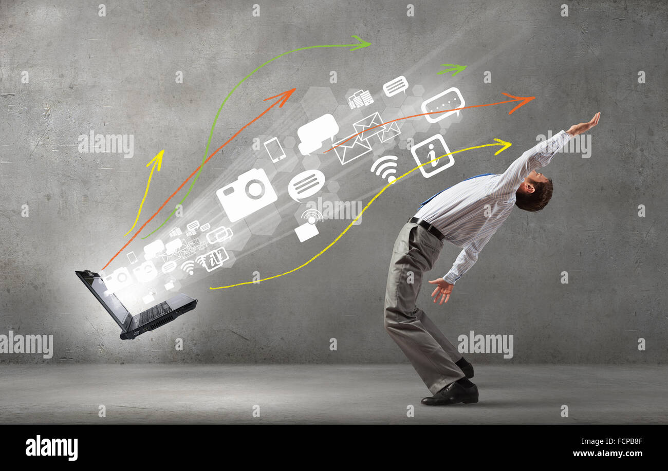 Balancing young man evading from explosion of ideas Stock Photo - Alamy
