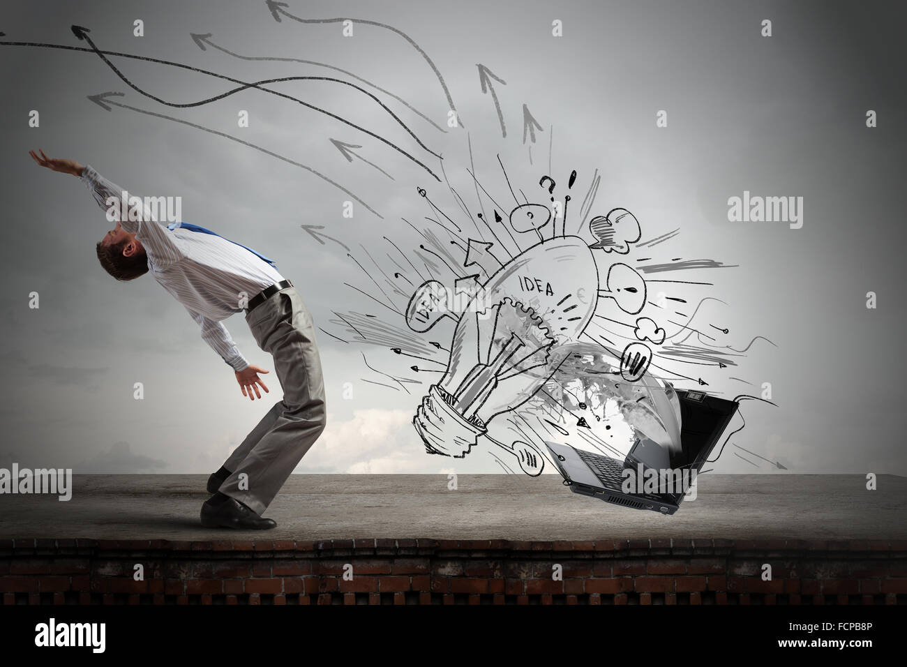 Balancing young man evading from explosion of ideas Stock Photo - Alamy