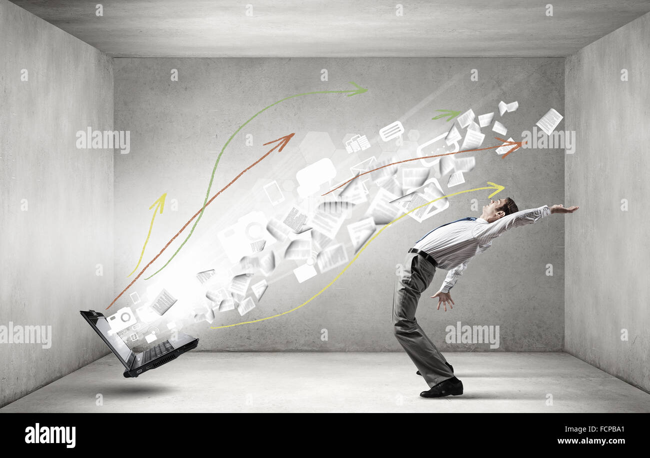 Balancing young man evading from explosion of ideas Stock Photo - Alamy