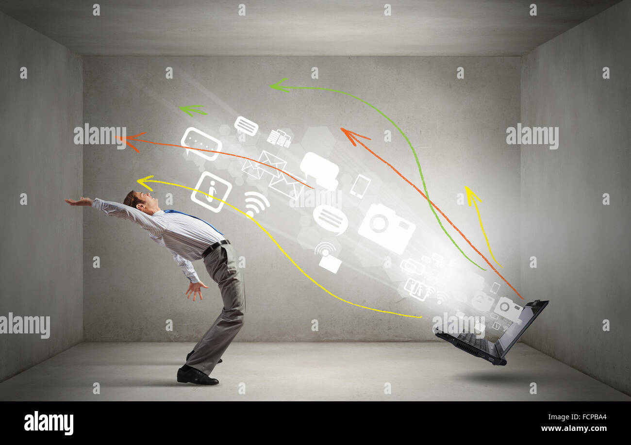 Balancing young man evading from explosion of ideas Stock Photo - Alamy