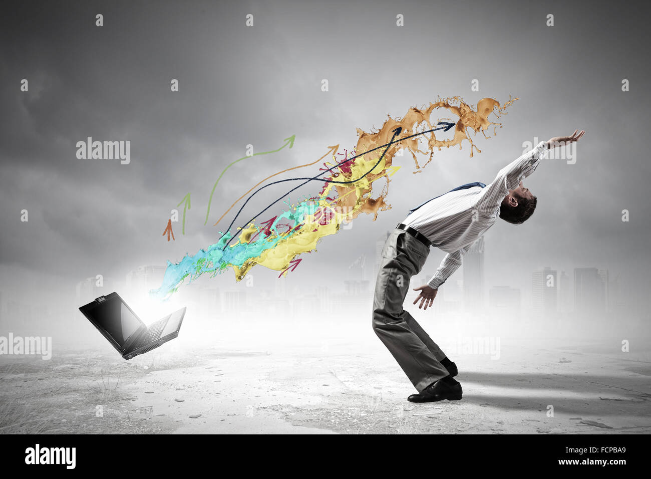 Balancing young man evading from explosion of ideas Stock Photo - Alamy