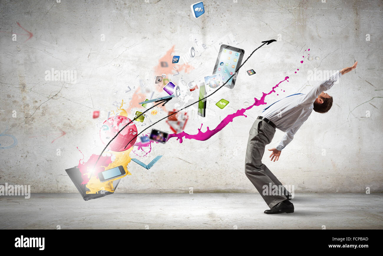 Balancing young man evading from explosion of ideas Stock Photo - Alamy