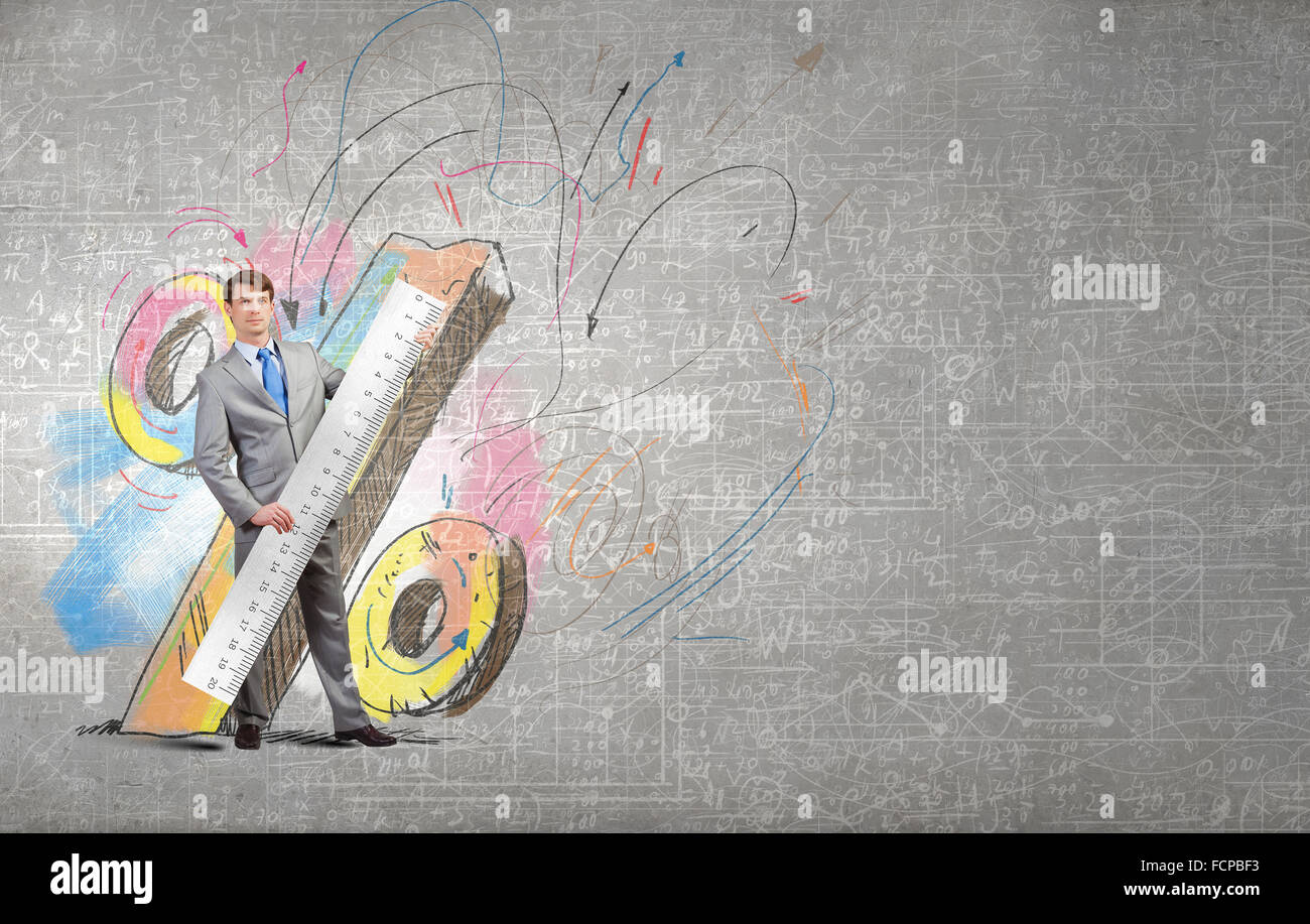 Young businessman in suit measuring ruler benefit Stock Photo - Alamy