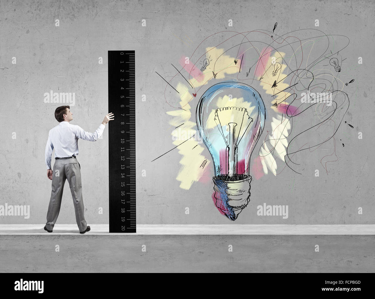 Young businessman in suit measuring ruler benefit Stock Photo - Alamy