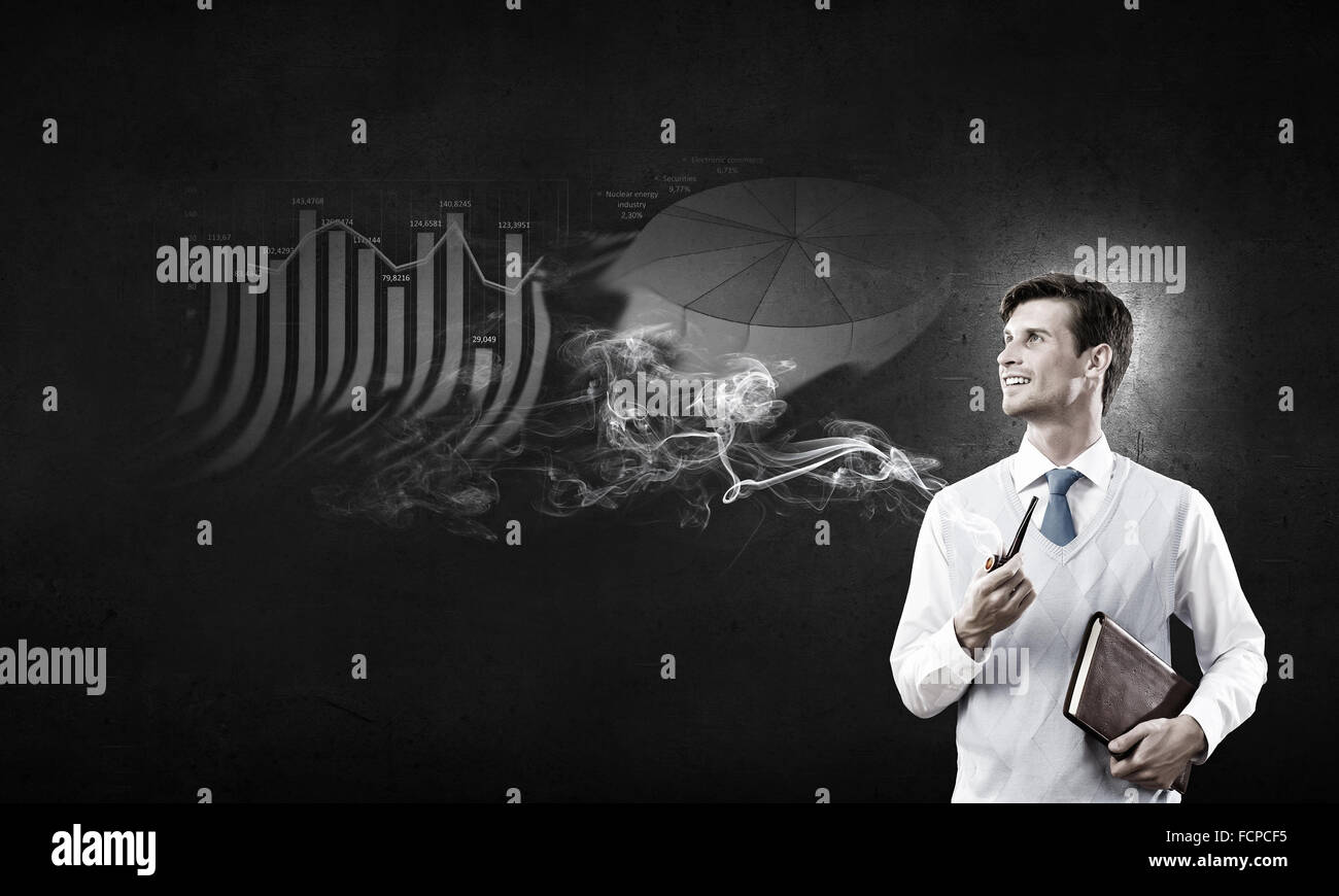 Handsome young businessman thinking over ideas and smoking pipe Stock ...