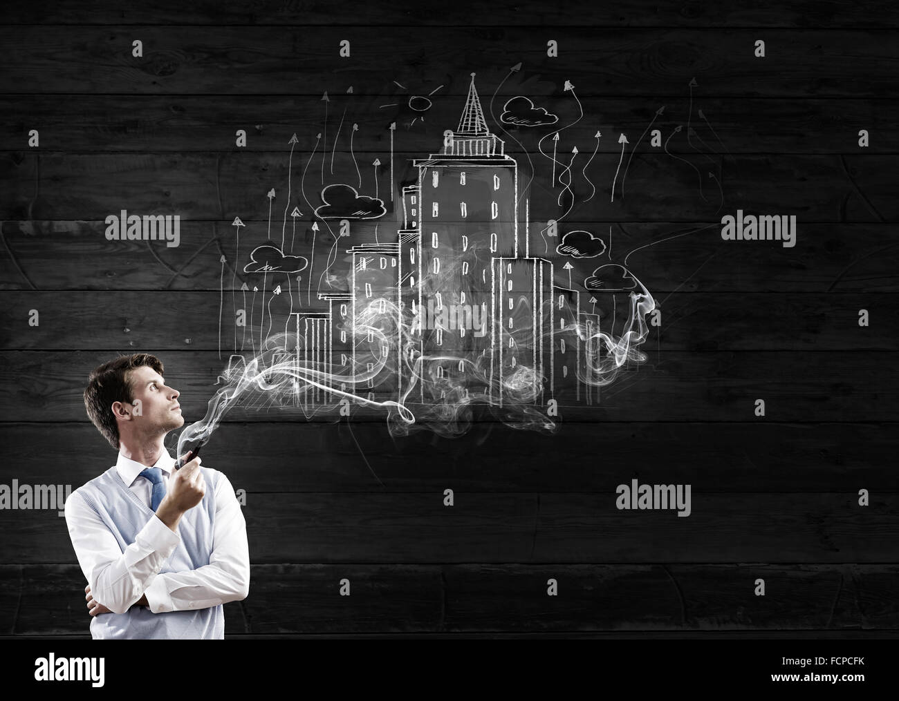 Handsome young businessman thinking over ideas and smoking pipe Stock ...