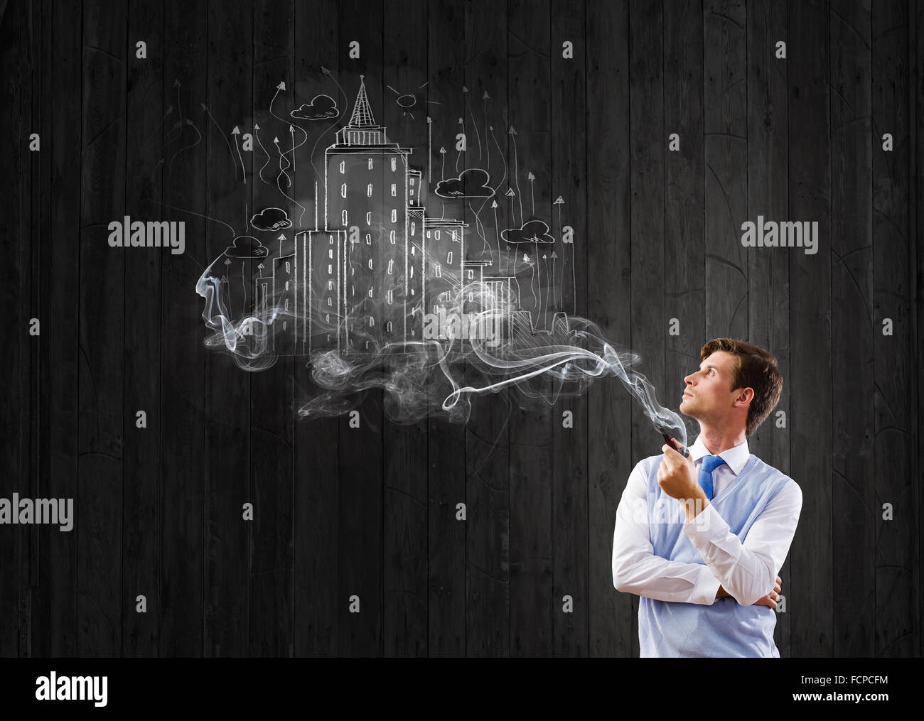 Handsome young businessman thinking over ideas and smoking pipe Stock ...