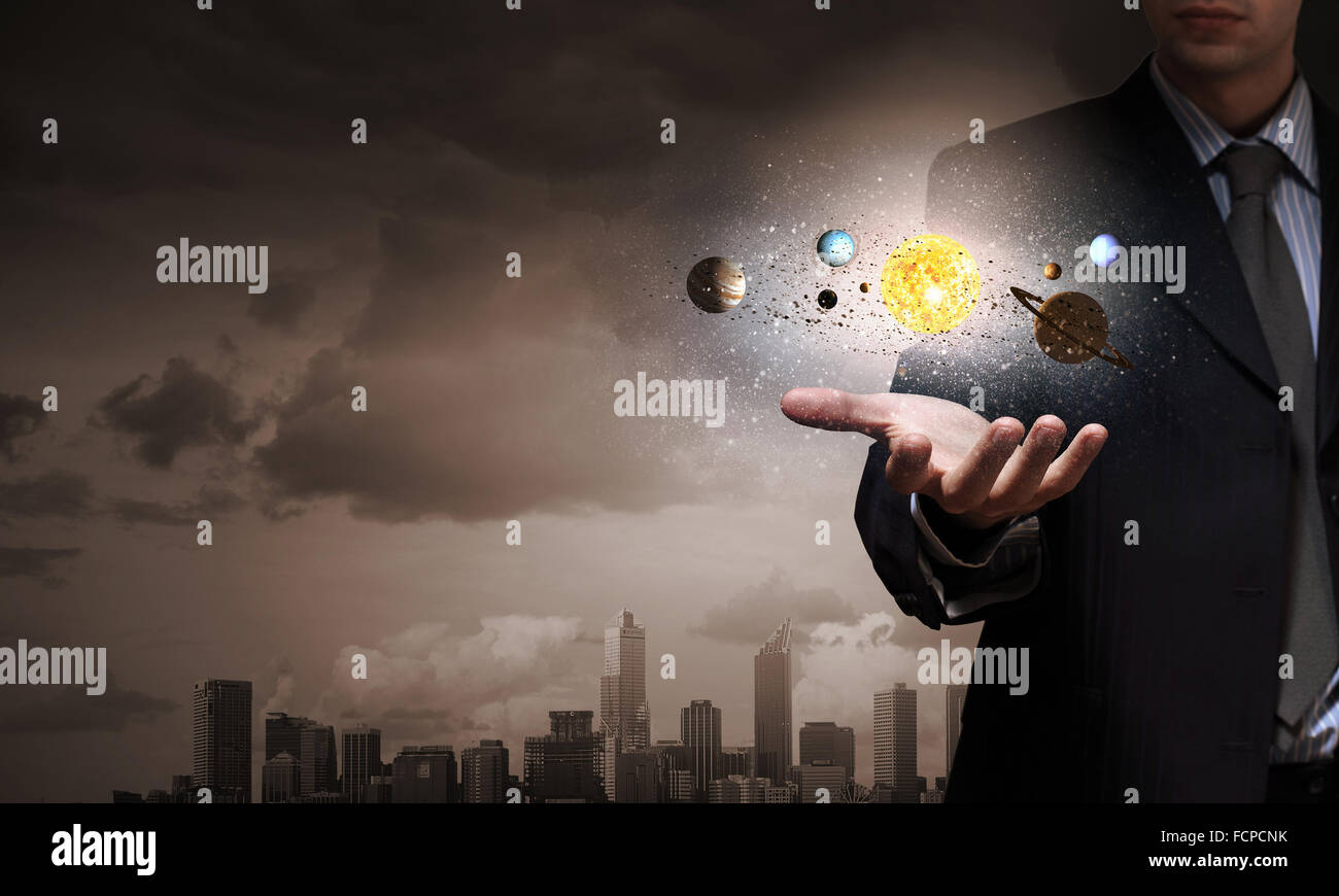 Close up of human hand with planet of sun system Stock Photo - Alamy