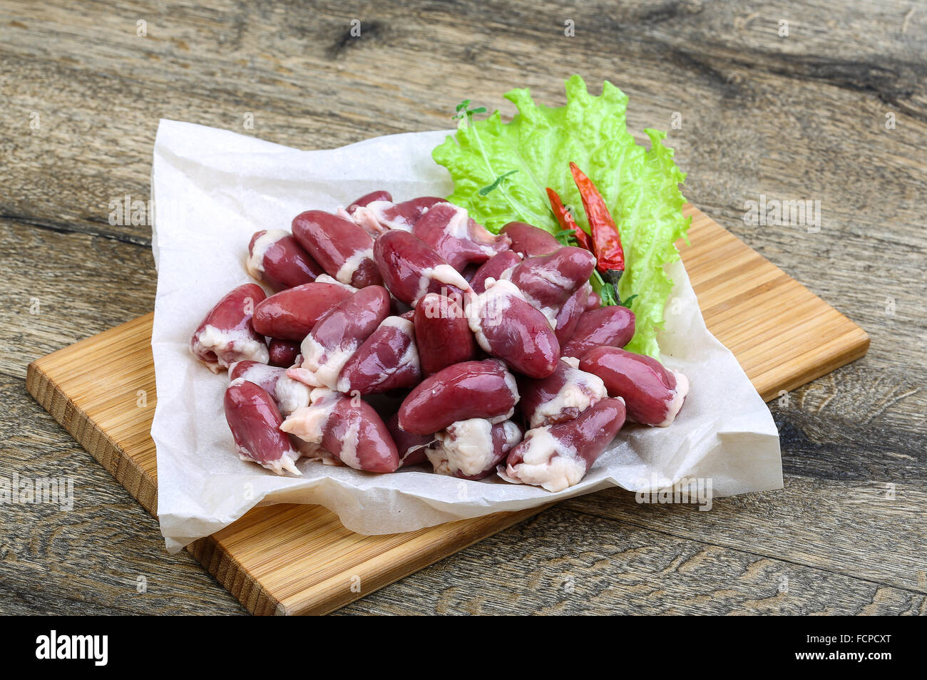Raw chicken hearts ready for cooking on the wood background Stock Photo ...