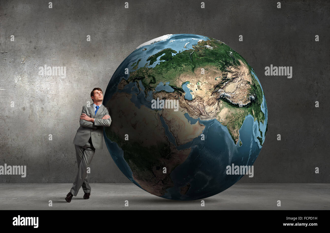 Businessman leaning on huge Earth planet. Elements of this image are ...