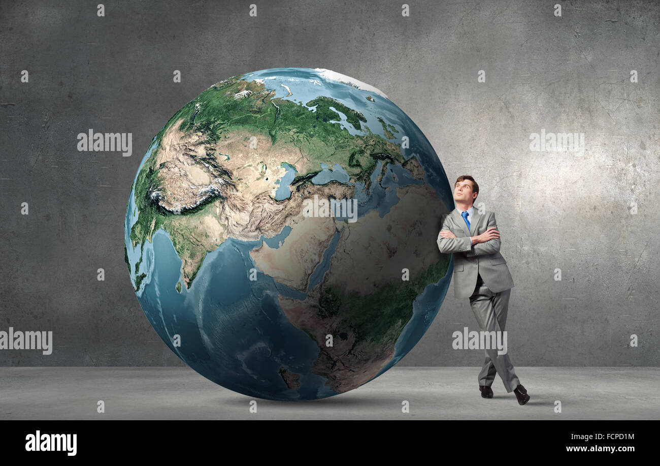 Businessman leaning on huge Earth planet. Elements of this image are ...
