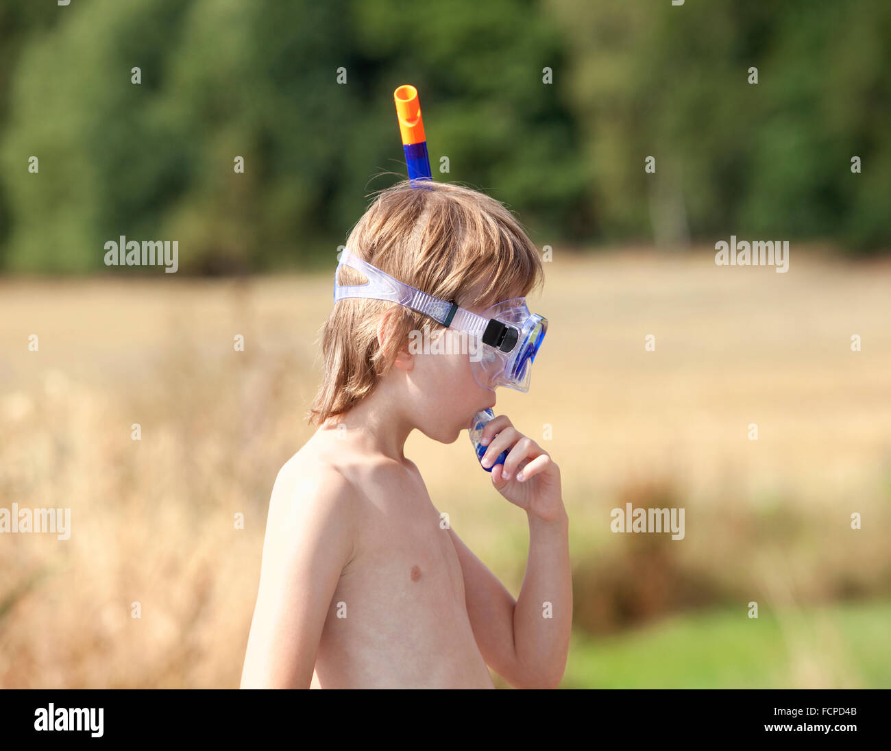 Boy Fitting in Breathing Tube before Snorkeling Stock Photo - Alamy