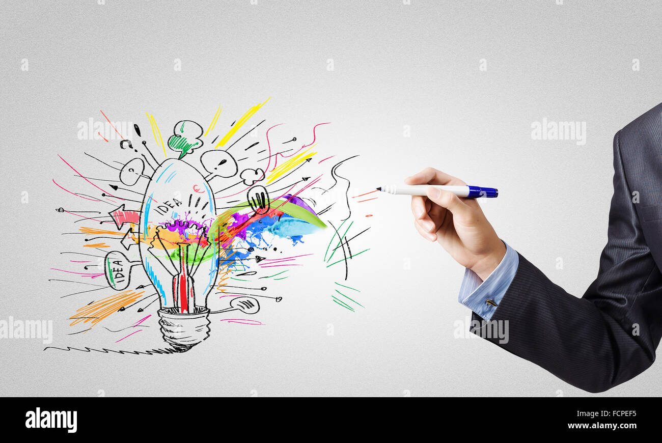 Human hand drawing light bulb isolated on white background Stock Photo ...