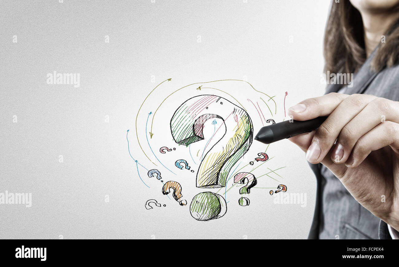 Close up of business woman drawing question mark Stock Photo - Alamy