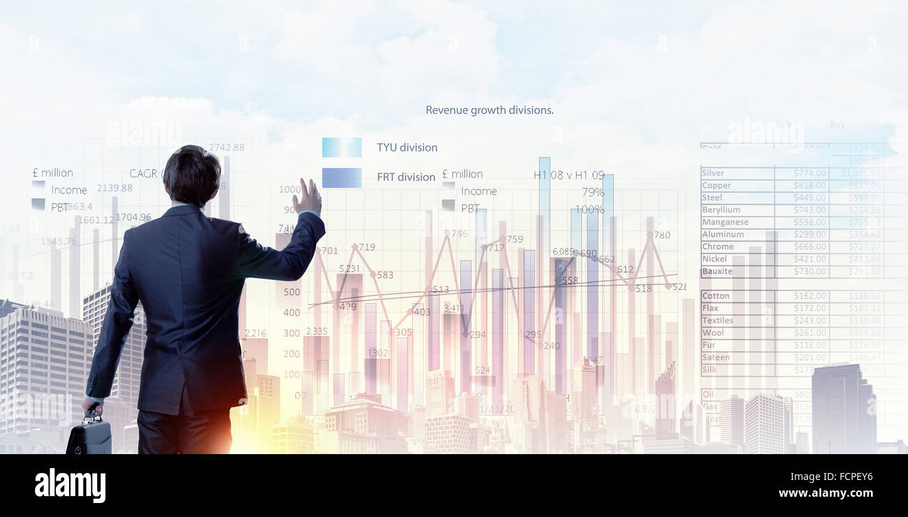 Rear view of businessman looking at business marketing strategy Stock ...